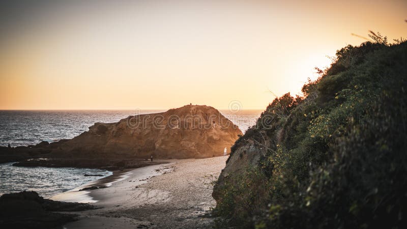 Cliff, Watching the Sunset Over the Ocean Stock Photo - Image of ...