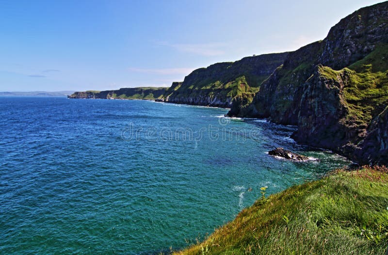 Cliffs Along Irish Coast Next To Tiny Carrick-a-rede Island Stock Photo ...