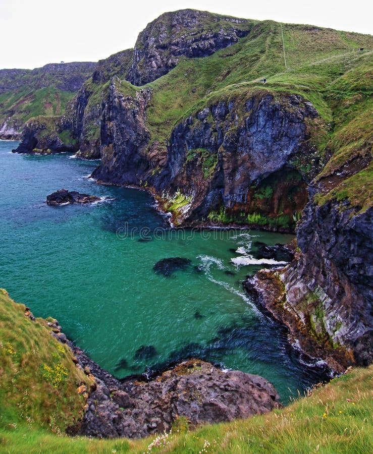 Cliffs Along Irish Coast Next To Tiny Carrick-a-rede Island Stock Image ...