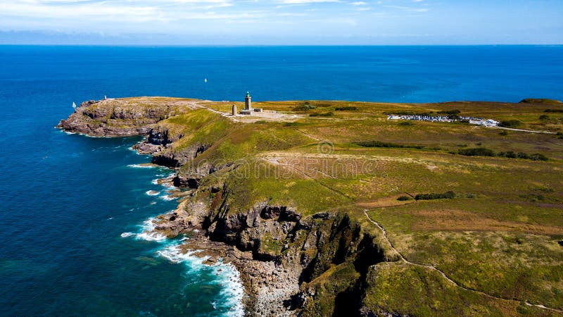 Cliffs at Atlantic Coast with Ancient Lighthouse at Cap Frehel in ...