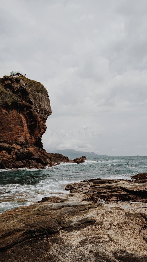 Cliffs by the beach stock photo. Image of rock, looks - 226628500