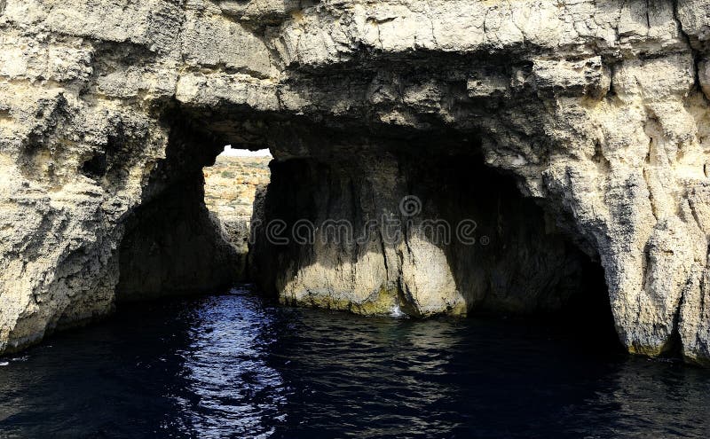 Cliffs and caves of Comino stock photo. Image of hull - 133953020