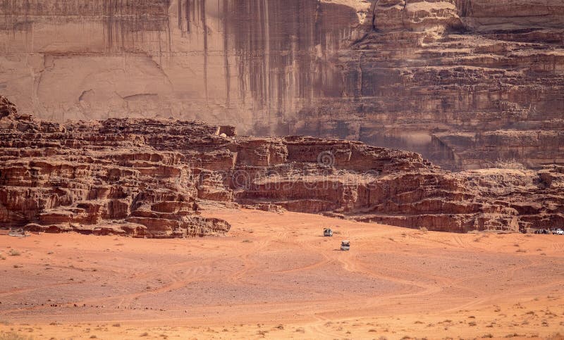 Cliffs and Caves on a Desert Full of Dry Grass Under a Cloudy Sky ...