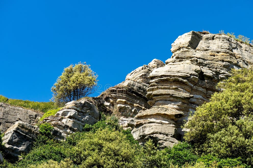 A Cliffs Edge Showing Layers of Sediment Stock Photo - Image of layers ...