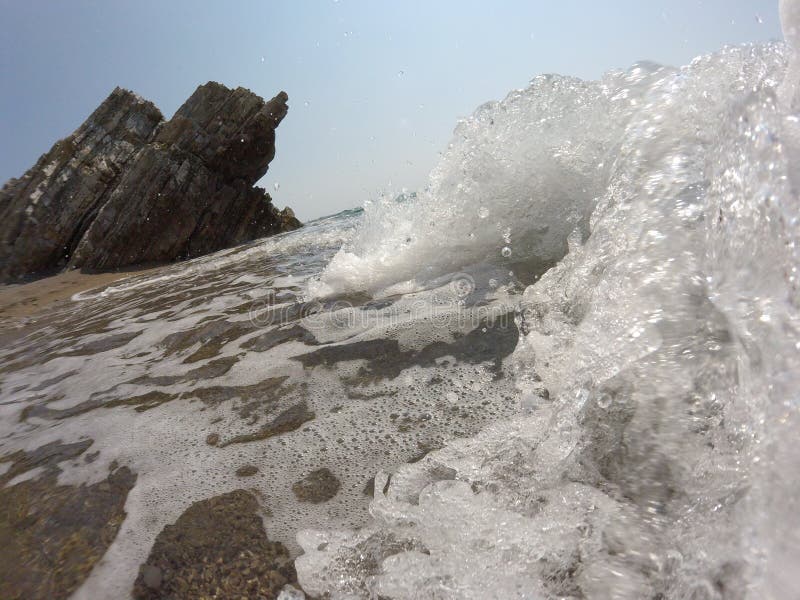 Cliffs, Frothy Waves Lapping on the Shore Stock Photo - Image of ...