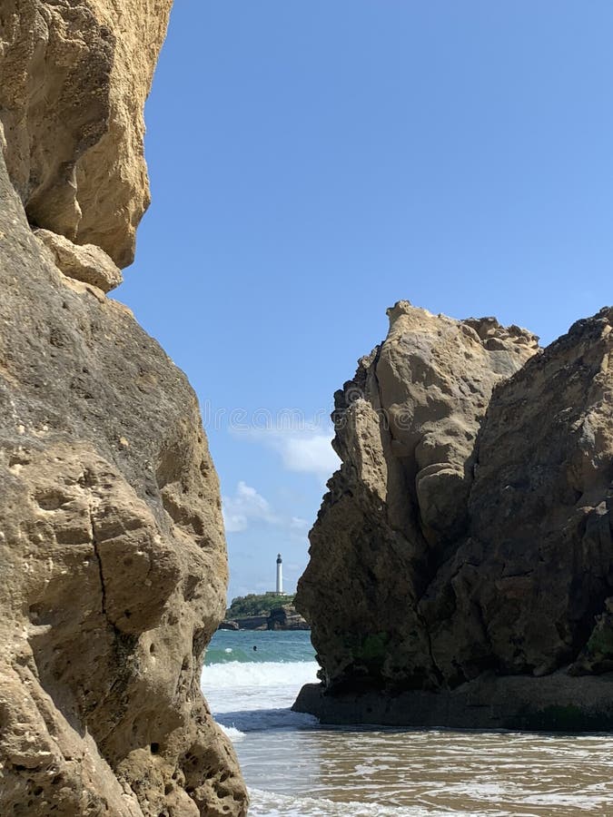 Cliffs and lighthouse view stock image. Image of view - 382881063