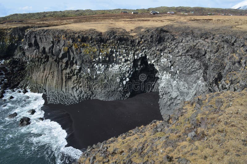 Cliffs Made of Rock Basalt Columns and a Black Sand Beach Stock Image ...