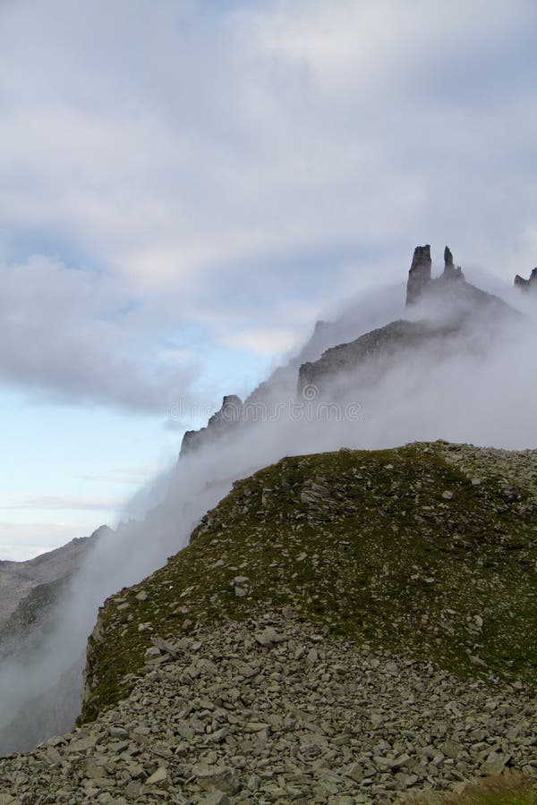 Cliffs in mist stock photo. Image of spooky, stone, alps - 43633324