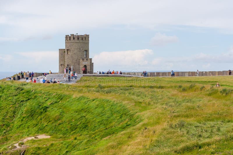 Cliffs of Moher, Ireland - July 7, 2007: Tourists Visiting O`Brien`s ...