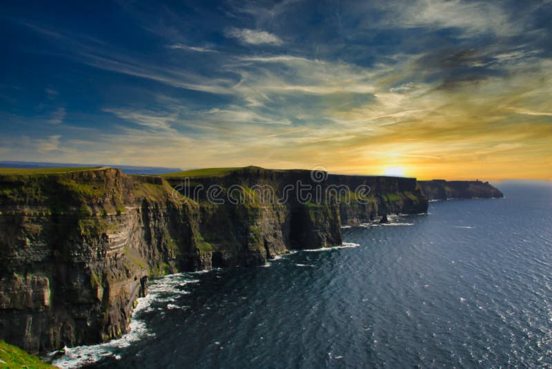 Cliffs of moher at sunset stock image. Image of cliff - 190858923