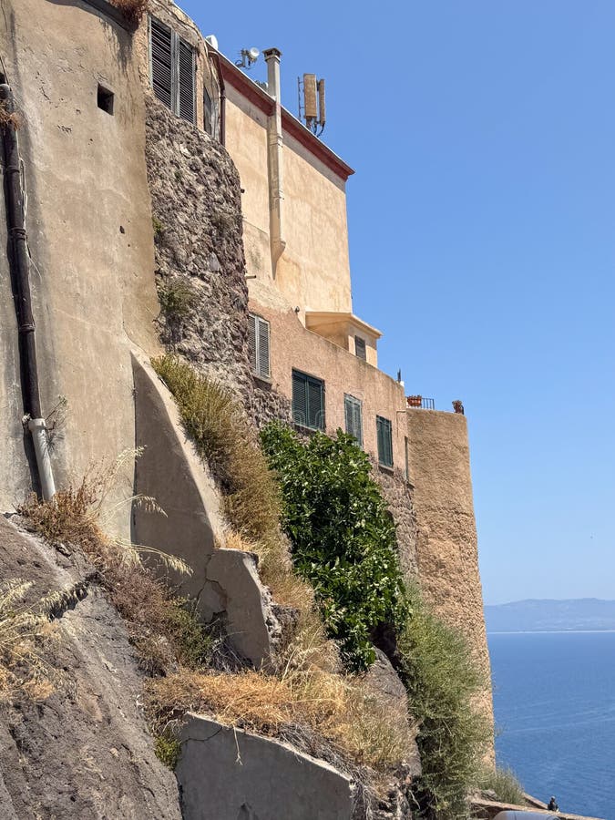 Cliffside Building Overlooking the Sea with Clear Sky Stock Image ...