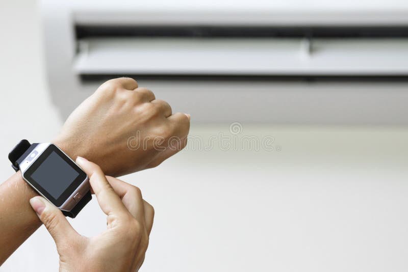 Climate Control with a Smartwatch. Woman Using AC. Stock Photo - Image ...
