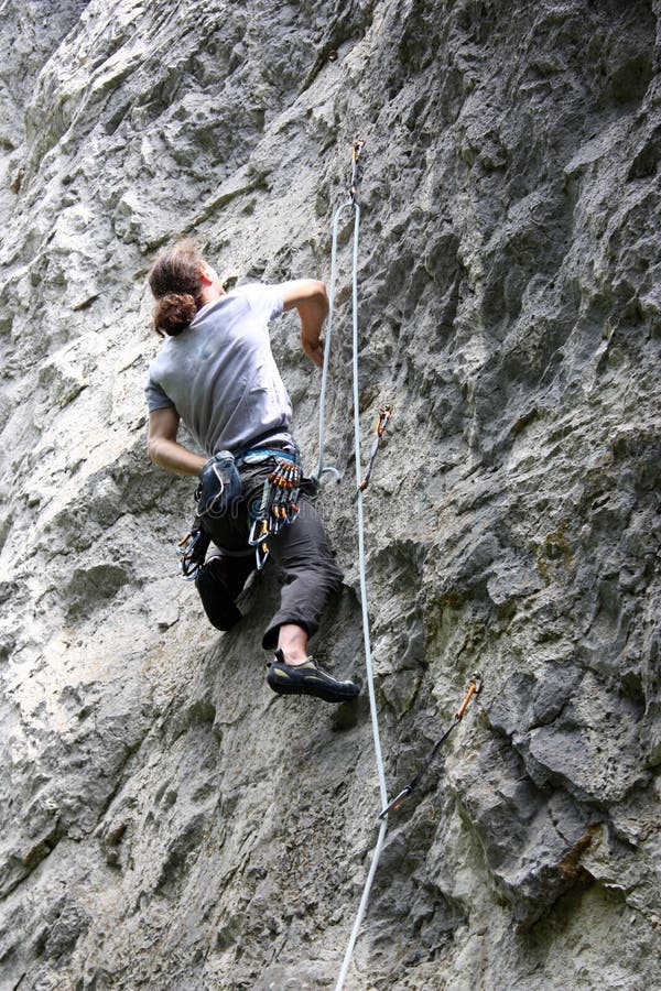 Outdoor Sport Activity.Happy Rock Climber Ascending a Challenging Cliff ...