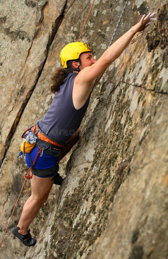 Outdoor Sport Activity.Happy Rock Climber Ascending a Challenging Cliff ...