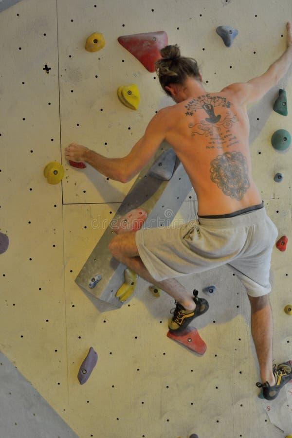 Climber in Action, Concentration before a Difficult Jump Editorial ...