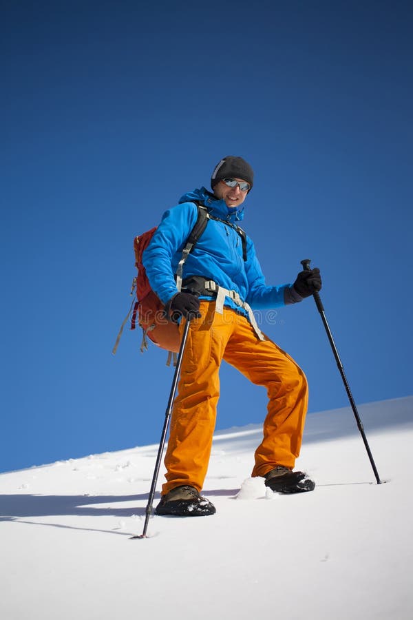 Climber with a Backpack Climbs the Snow. Stock Photo - Image of ...