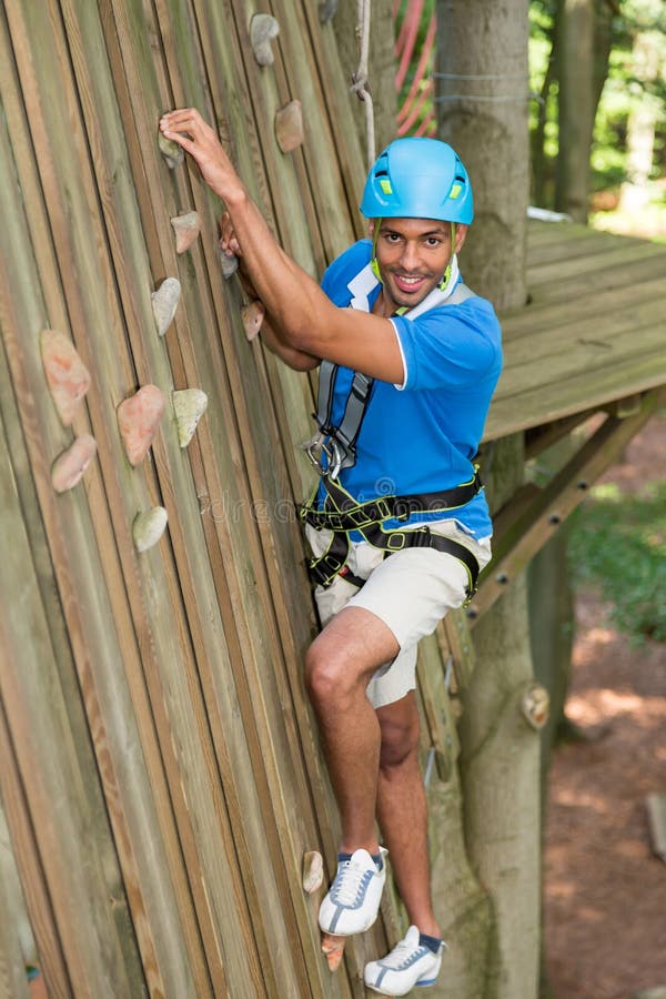 Climber in Climbing Wall at High Rope Course Stock Photo - Image of ...