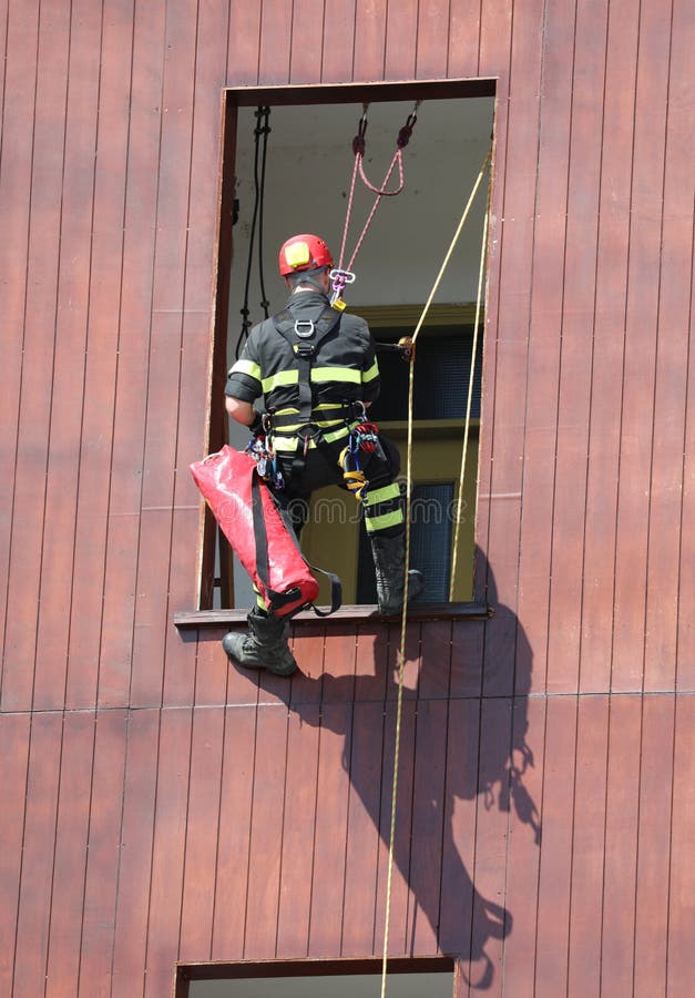 Climber Firefighter Go in the House by Window Stock Photo - Image of ...