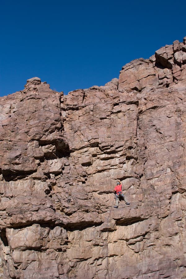 Climber halfway up cliff stock photo. Image of america - 3440222