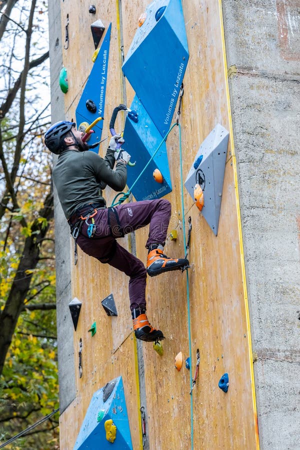 Climber with Ice Axes Climbing on Artificial Ice Climbing and ...