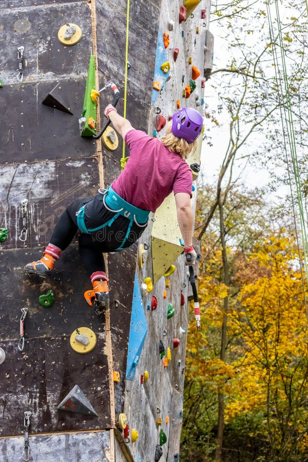 Climber with Ice Axes Climbing on Artificial Ice Climbing and ...
