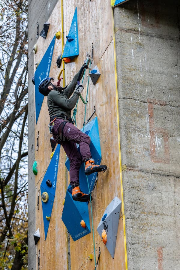 Climber with Ice Axes Climbing on Artificial Ice Climbing and ...