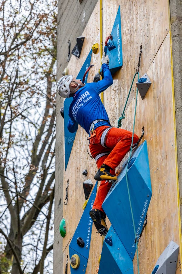 Climber with Ice Tools Climbing on Artificial Ice Climbing and ...