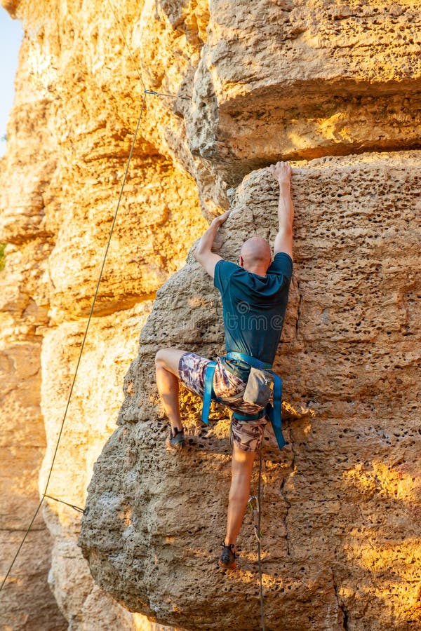 Climber on the mountain stock photo. Image of equipment - 151494944