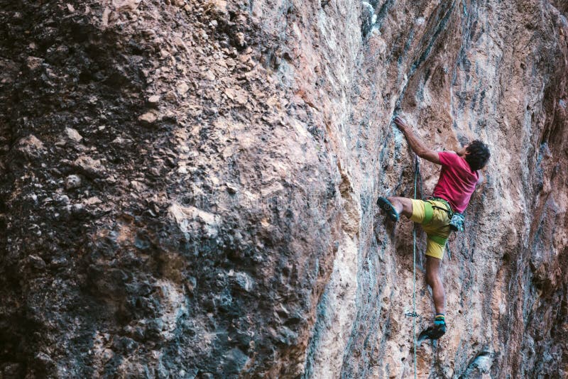 Climber Overcomes a Difficult Climbing Route on a Natural Terrain Stock ...
