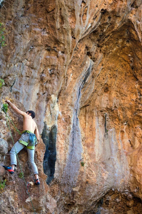 Climber Overcomes a Difficult Climbing Route on a Natural Terrain Stock ...