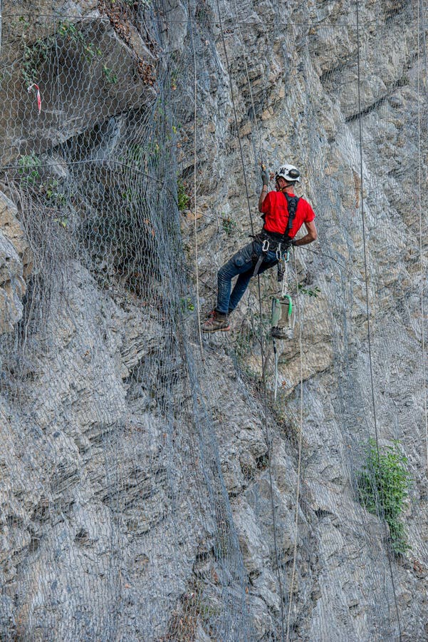 Climber Placing Safety Nets To Avoid Falling Rocks Editorial Stock ...