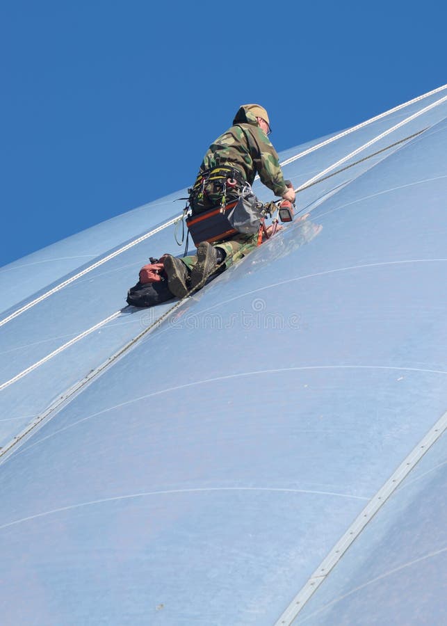 The Climber is Working on the Roof. Editorial Photography - Image of ...