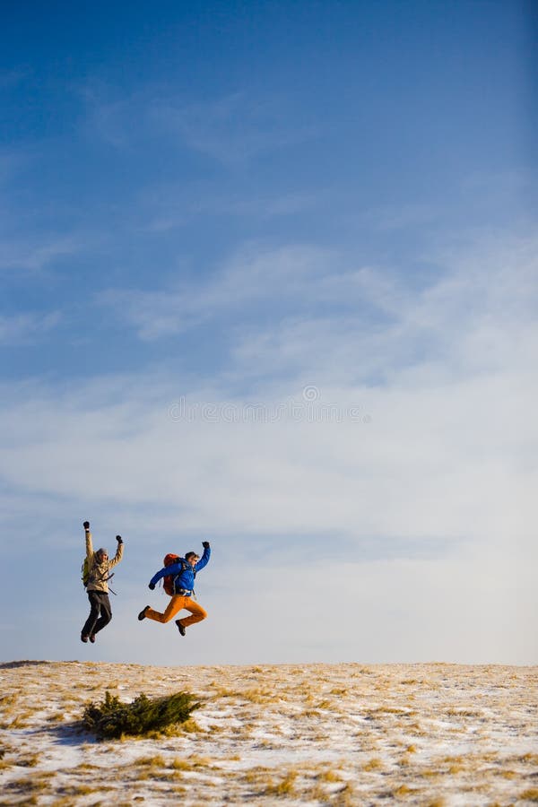 Climbers jumping for joy. stock photo. Image of hike - 76844278