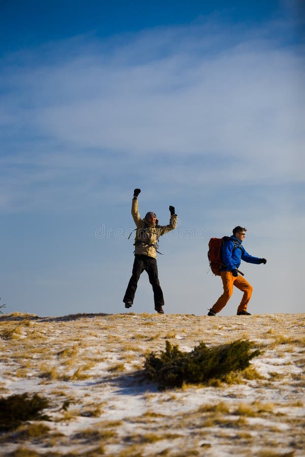 Climbers jumping for joy. stock image. Image of fitness - 76844441