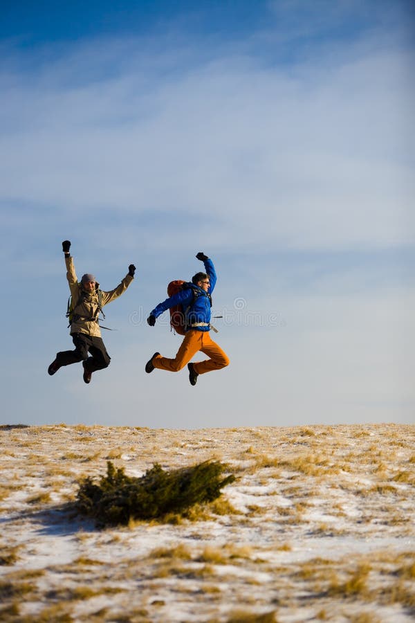 Climbers jumping for joy. stock photo. Image of emotion - 76844754