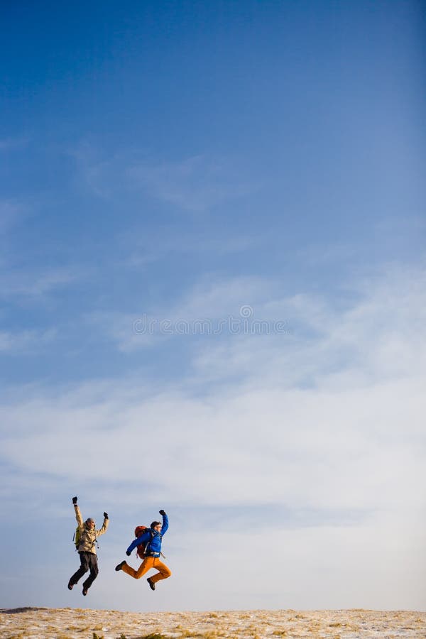 Climbers jumping for joy. stock photo. Image of male - 81884104