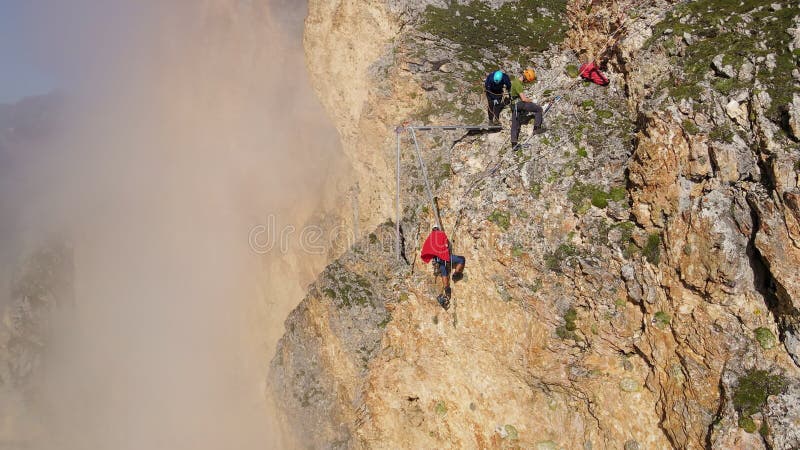 Climbers Set Up a Springboard for Jumping Down on Ropes on the High ...