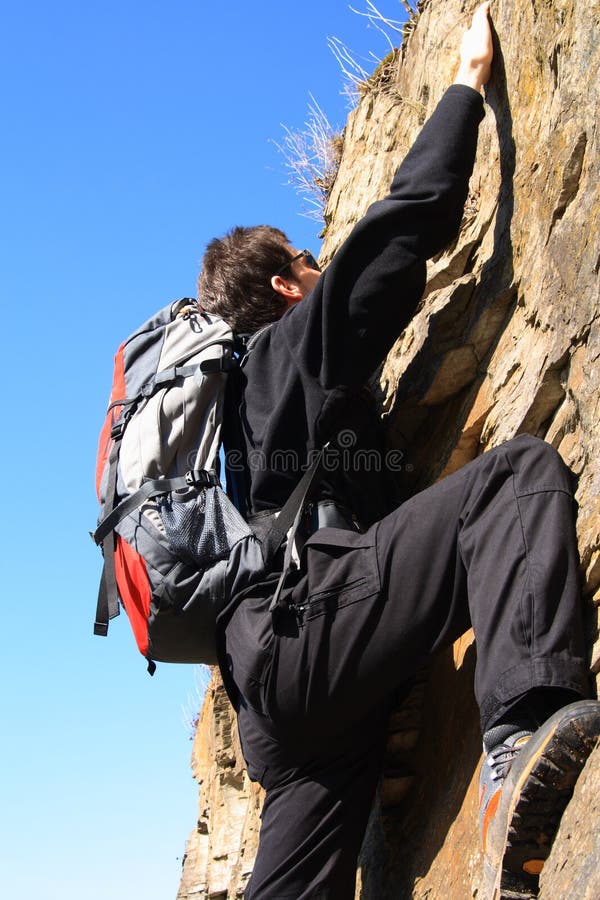 Climbing on a rock stock image. Image of moving, agile - 2208065