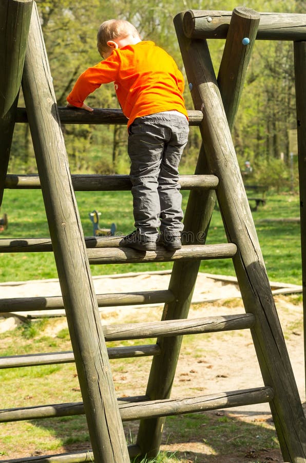 Courageous child on ladder stock image. Image of backlit - 21933185