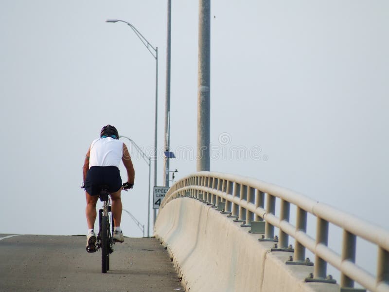 Climbing cycler stock image. Image of bike, climb, cycling - 1299241