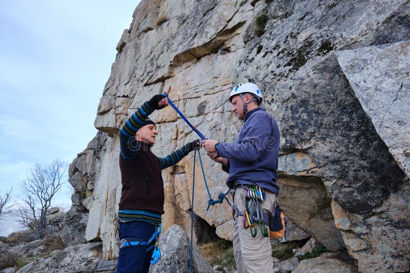 A Climbing Instructor Explains How To Make a Belay Station Stock Image ...