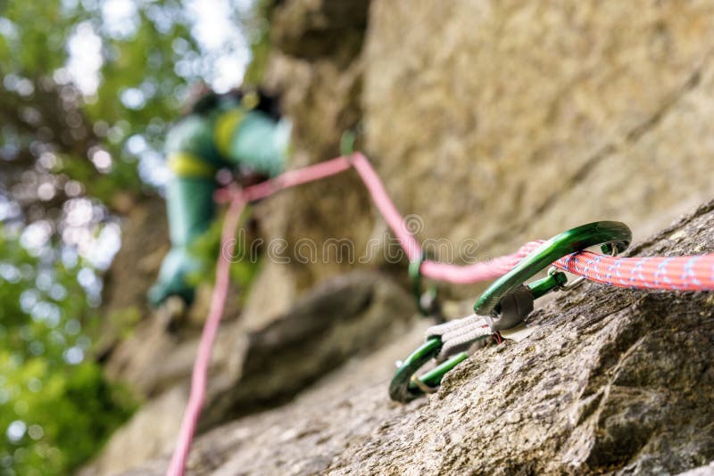 Climbing on rock with rope stock image. Image of bolt - 138771955