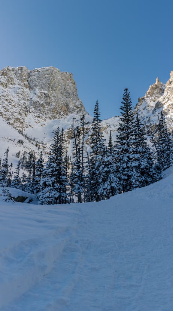Climbing a Snow Drift in Colorado Mountains Stock Image - Image of ...
