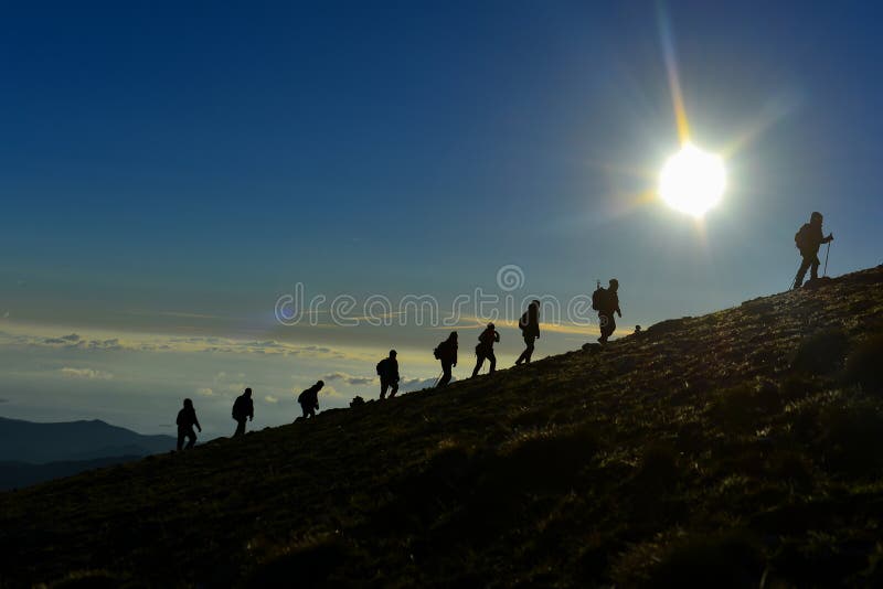 Climbs of the Crowded Mountain Group at Sunrise Stock Photo - Image of ...