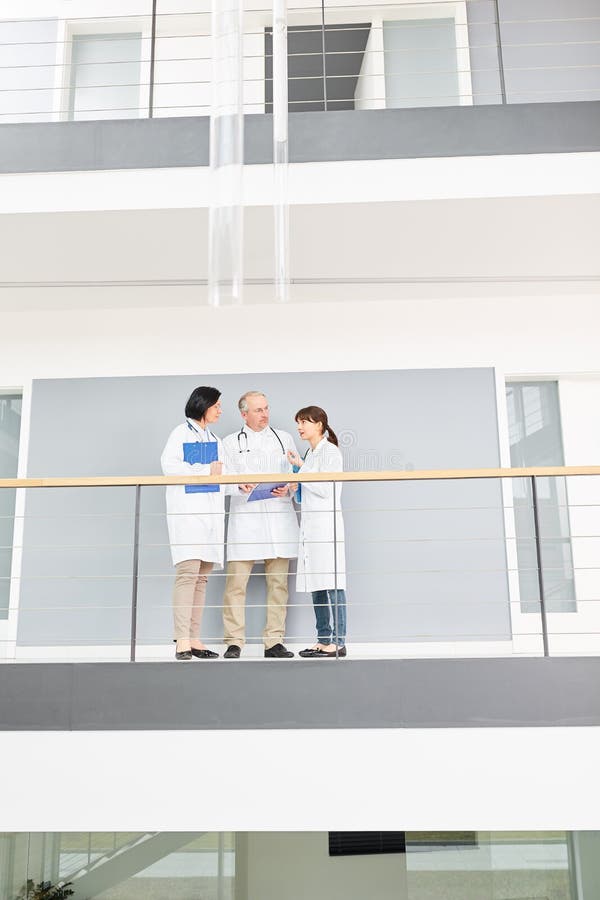 Clinic Team of Doctors Discuss in Cooperation Stock Photo - Image of ...