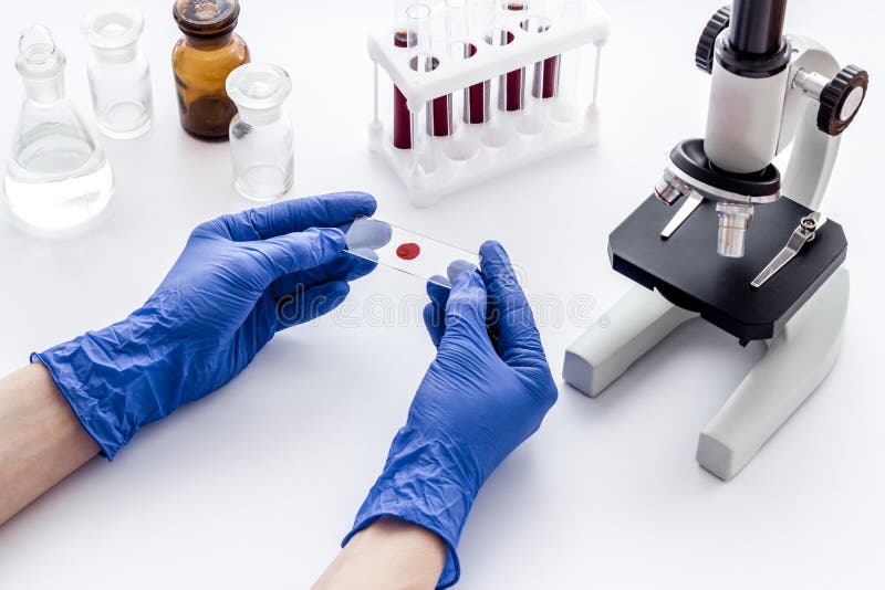 Clinical Science Research with Microscope. Hand Writes Test Results on ...