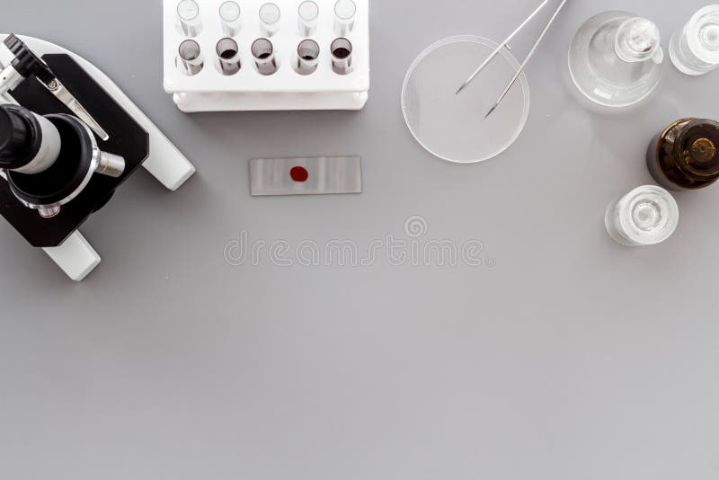 Clinical Science Research with Microscope. Hand Writes Test Results on ...