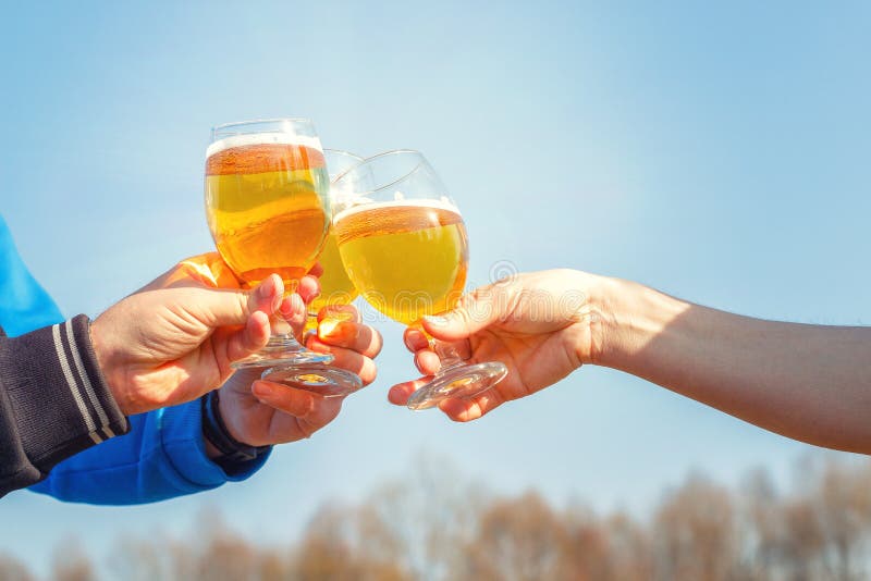 Beer clinking glasses. stock photo. Image of toast, people - 85407050
