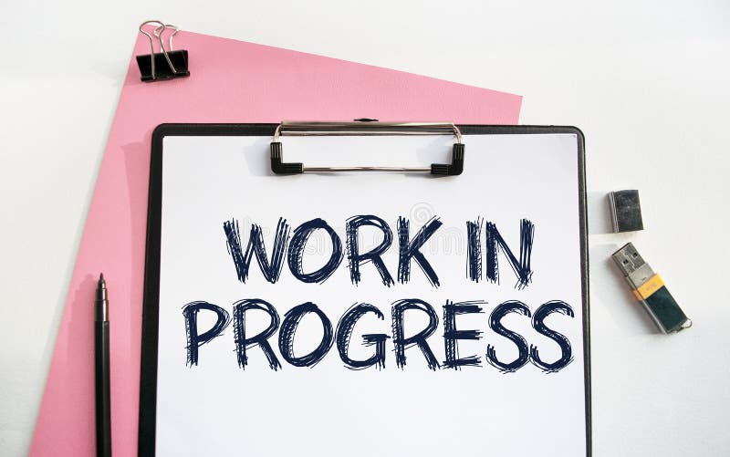 A Clip-on Binder Labeled WORK in PROGRESS. Top View of a Work Table ...