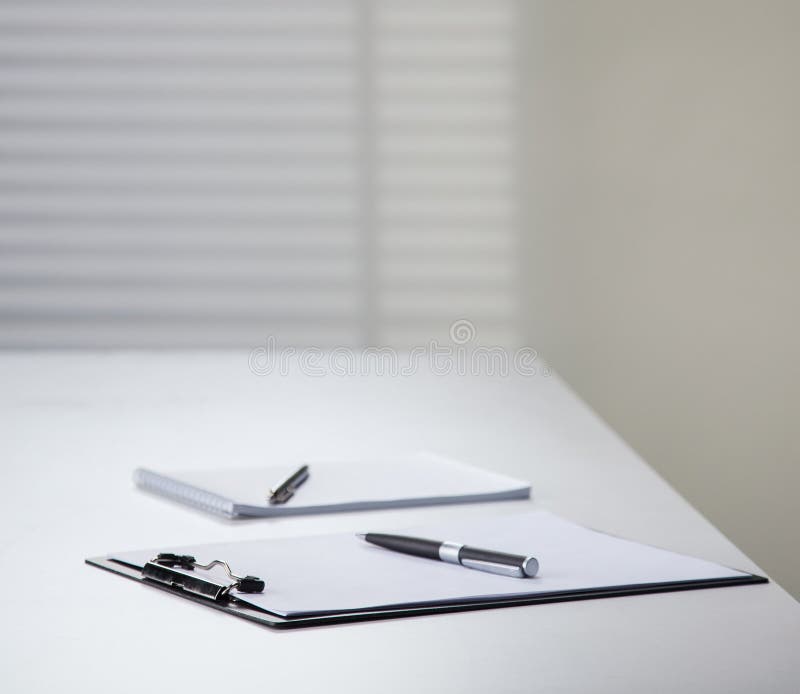 Pens and pad on table stock image. Image of coffee, notepad - 15586813